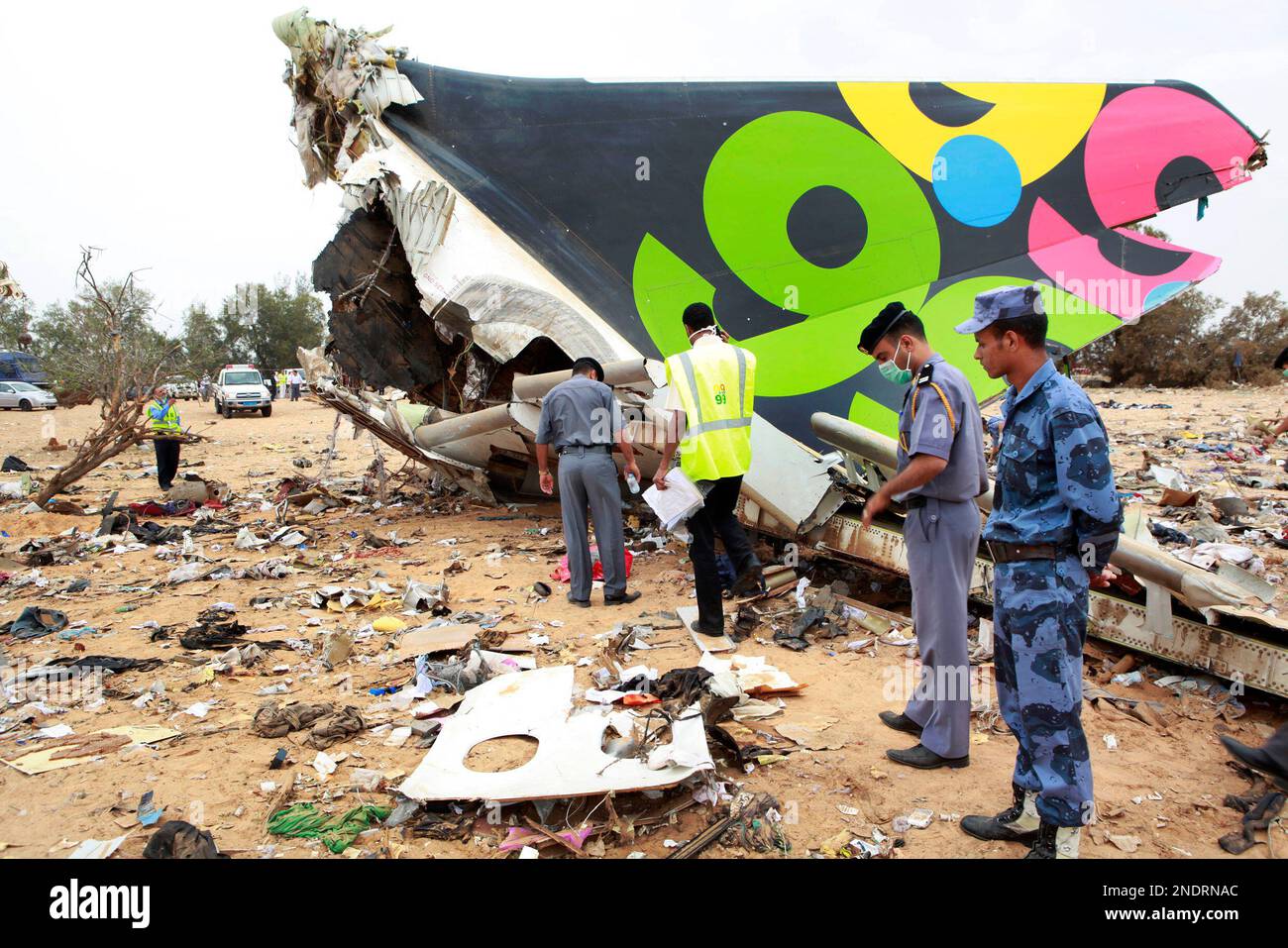 Rescue teams search the site of the Libyan Afriqiyah Airways plane crash in Tripoli, Libya ...