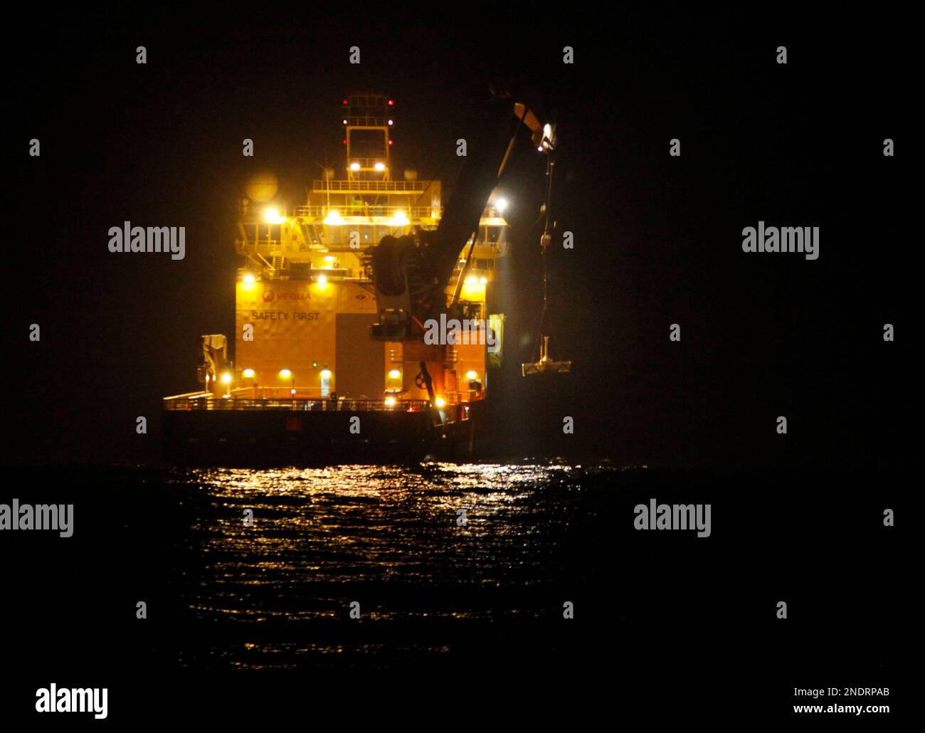 The Viking Poseidon lowers the top hat device at the site of the ...