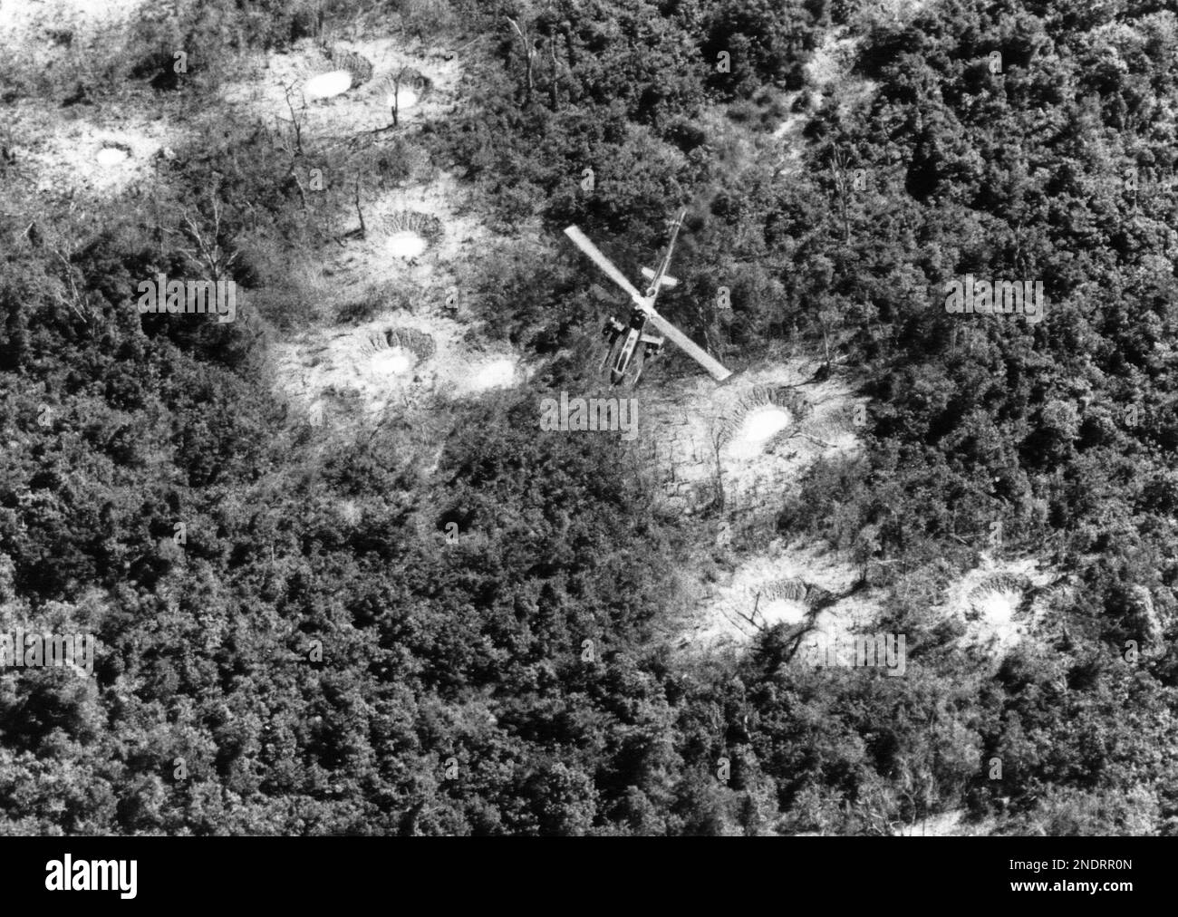 An American Cobra helicopter gunship cruises over part of Vietnam’s ...