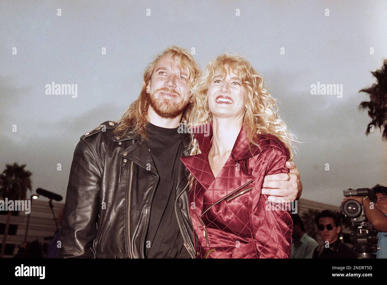 Actress Laura Dern gets a hug from her boyfriend, director Renny Harlin ...