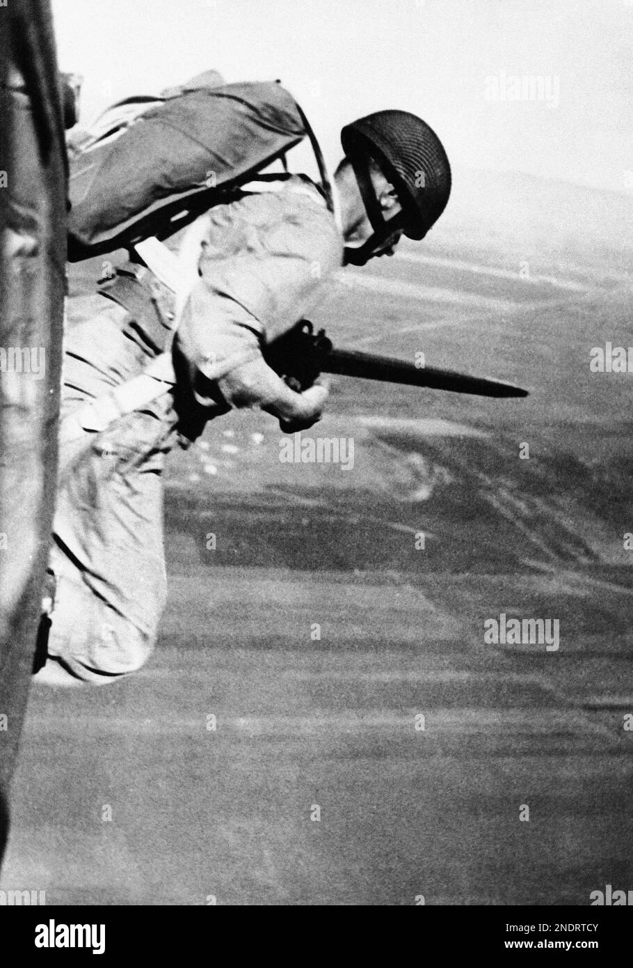 A British paratrooper is shown in a dramatic take-off from his plane ...