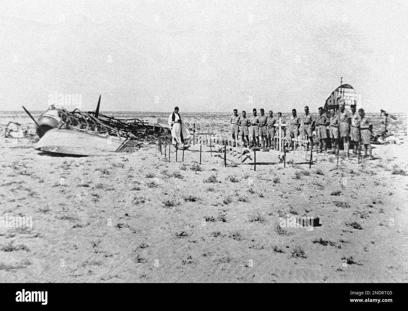 A funeral service is read over the graves of Lt. Gen. William Henry ...