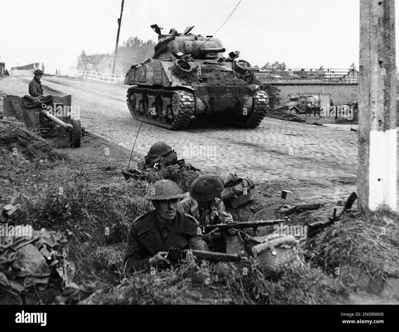 British tanks crossing over a bridge across the Albert Canal at Beringen, Sept. 8, 1944. The ...