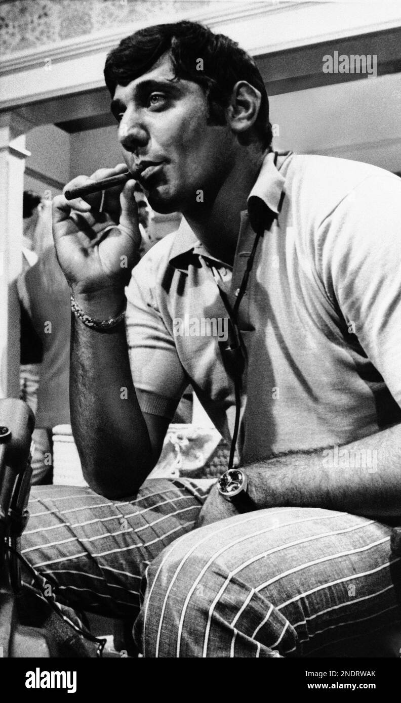 Joe Namath, star quarterback of the New York Jets, sits with cigar in ...