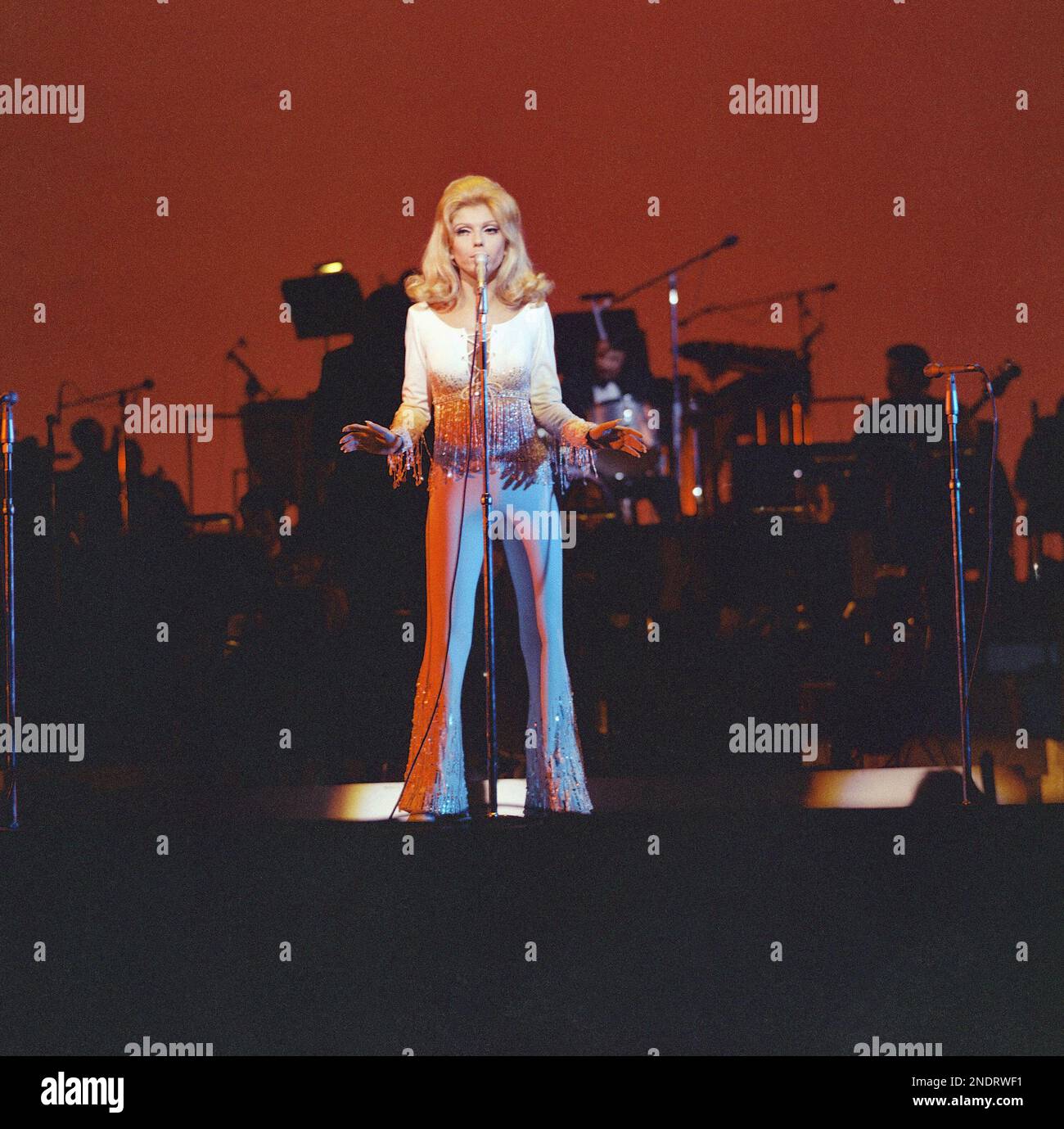 Pop singer Nancy Sinatra is shown performing at her opening in Las ...