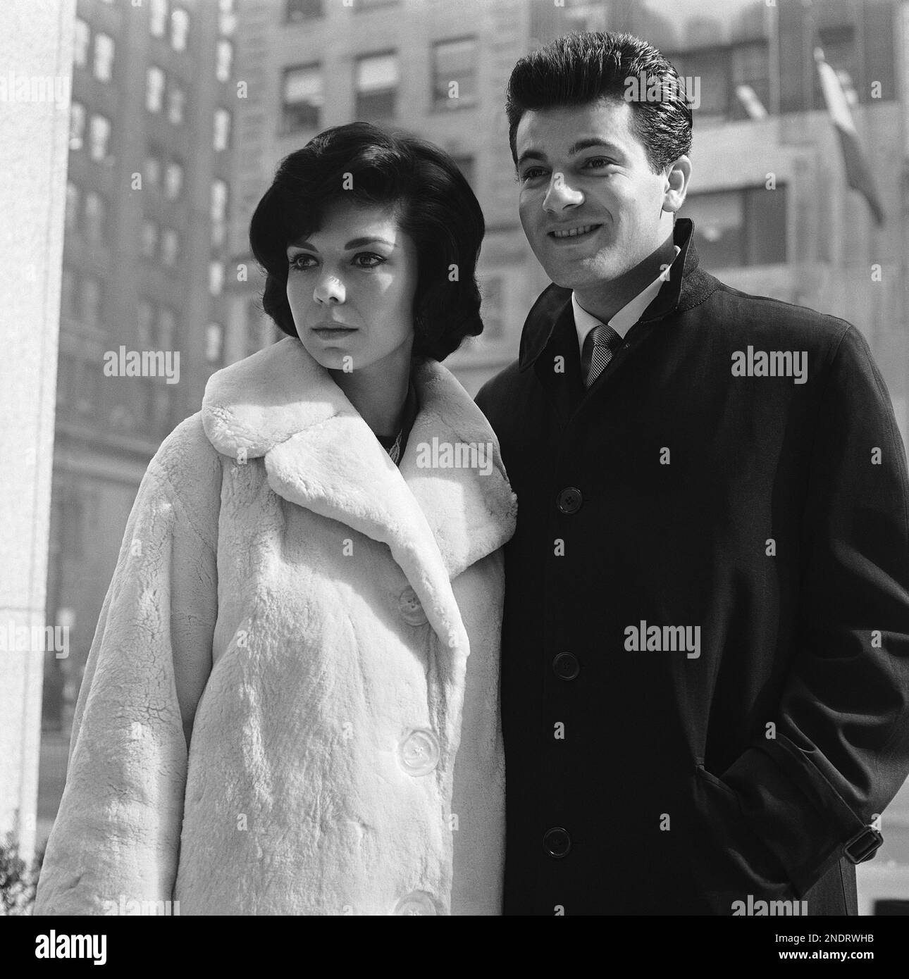 Tommy Sands and his wife Nancy Sinatra are shown window shopping on ...