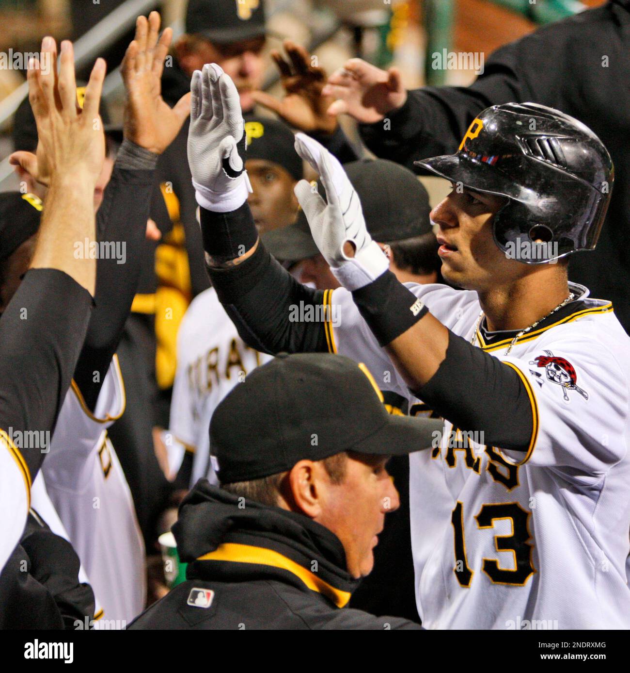 Pittsburgh Pirates' Ronnie Cedeno (13) celebrates with teammates after ...
