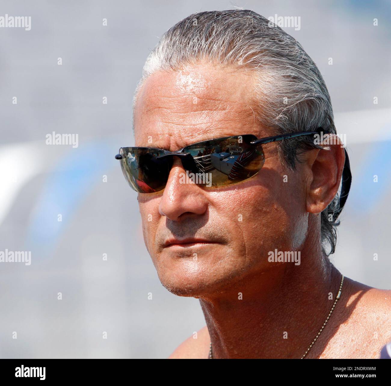 Four-time Olympic gold medalist Greg Louganis watches the competition ...