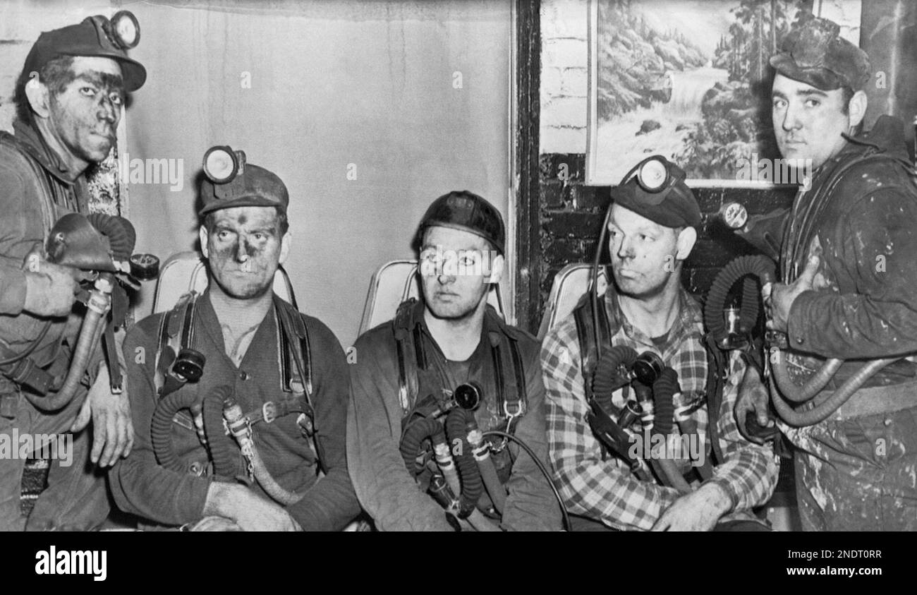 Five members of a crack coal mine rescue team await orders to move down ...