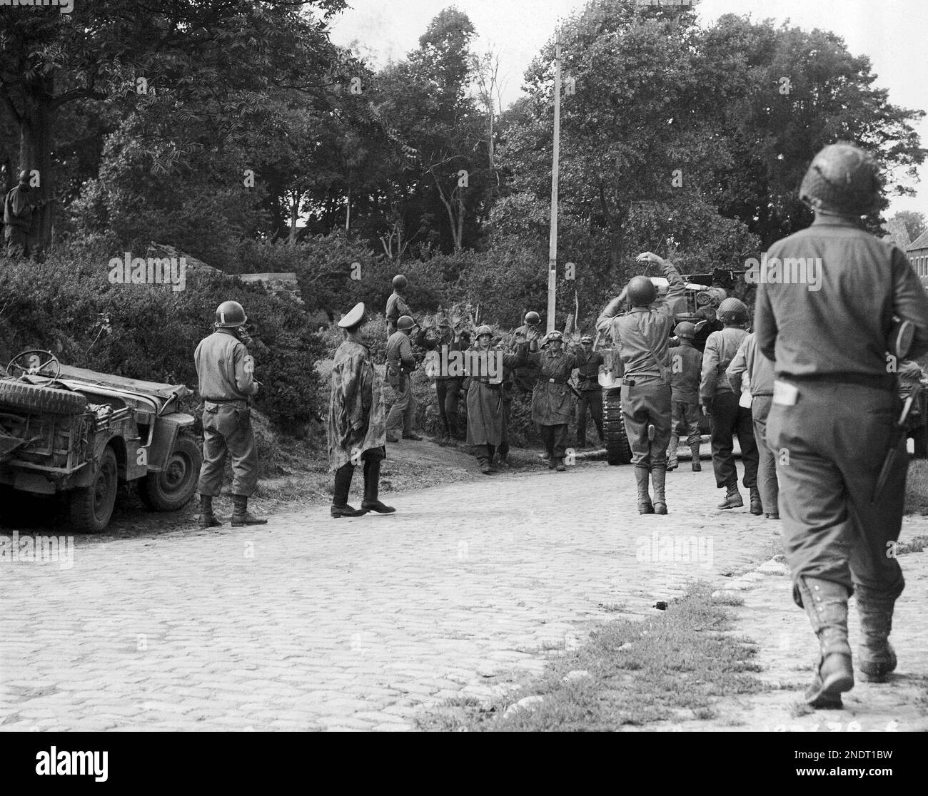 German soldiers emerge from their hiding places on the outskirts of ...