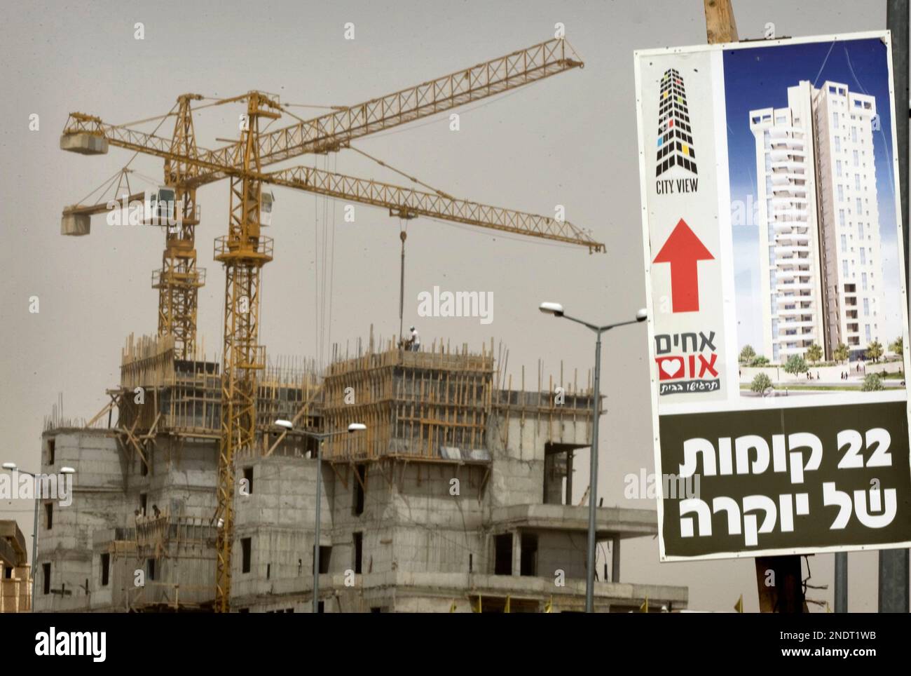 A construction worker prepare a new housing development in the Jewish ...