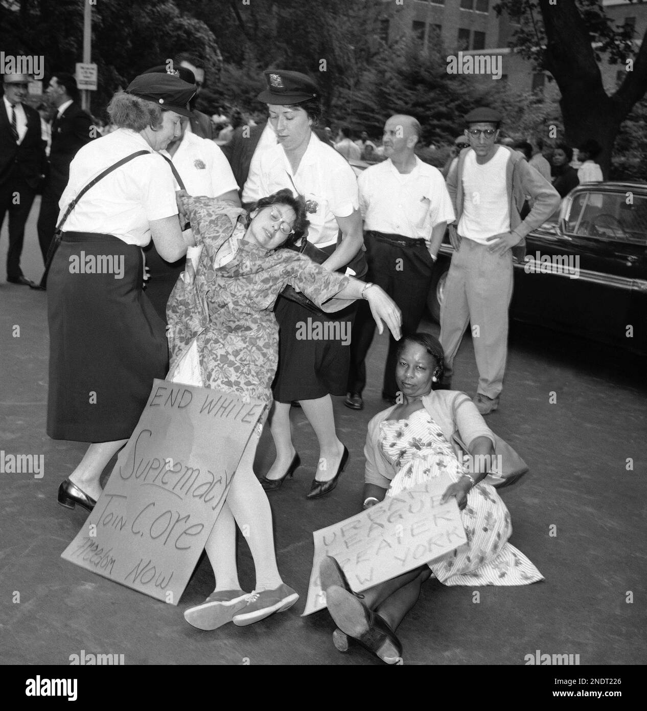 New York City policewomen lift a demonstrator for the Congress of ...