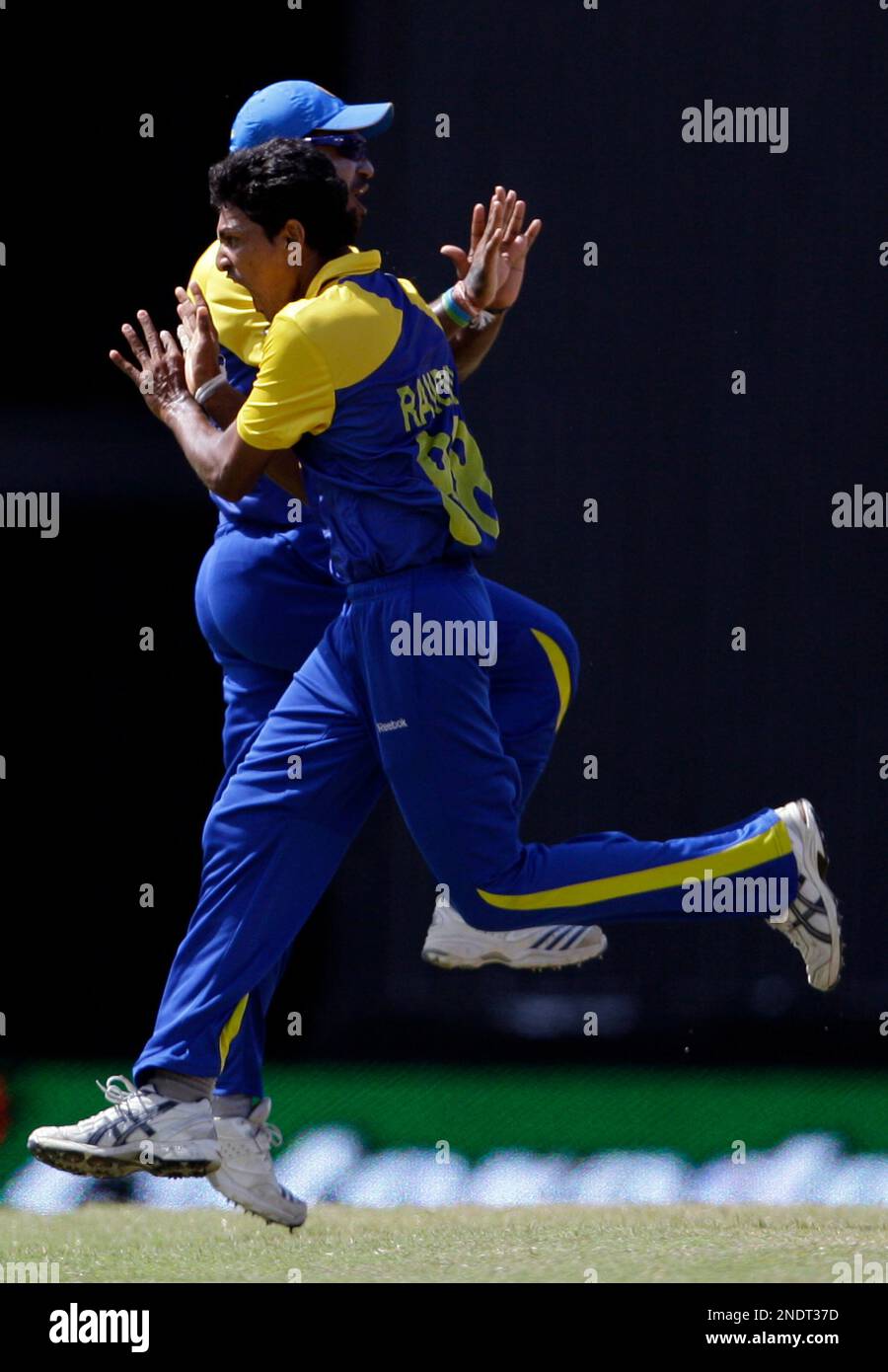 Sri Lanka's Chamara Kapugedara, in cap, and teammate Suraj Randiv ...