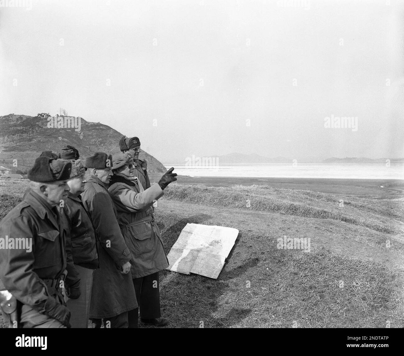 Gen. Douglas MacArthur points across Han River toward Seoul during his ...