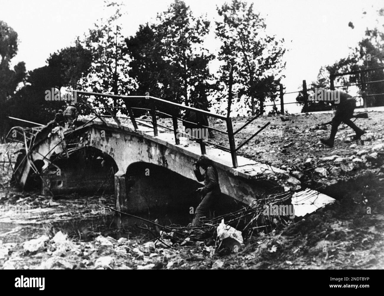 German shock troops are purported to be shown here crossing a ...