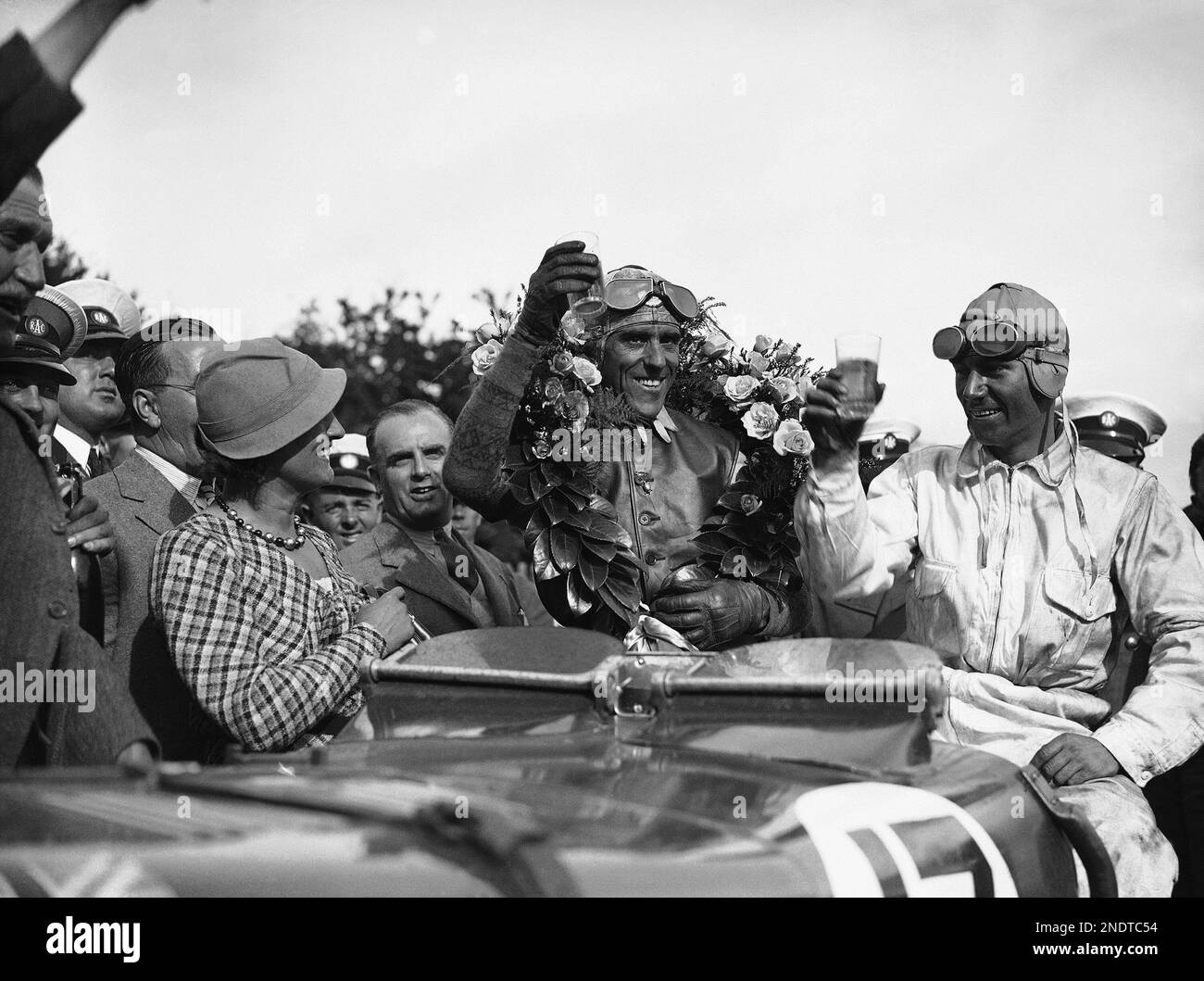Italian motorcycle and race car driver Tazio Nuvolari, centre ...