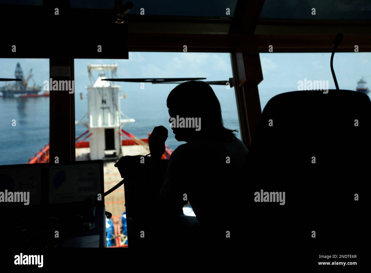 Capt. Demi Shaffer, foreground, pilots the Joe Griffin next to the the ...