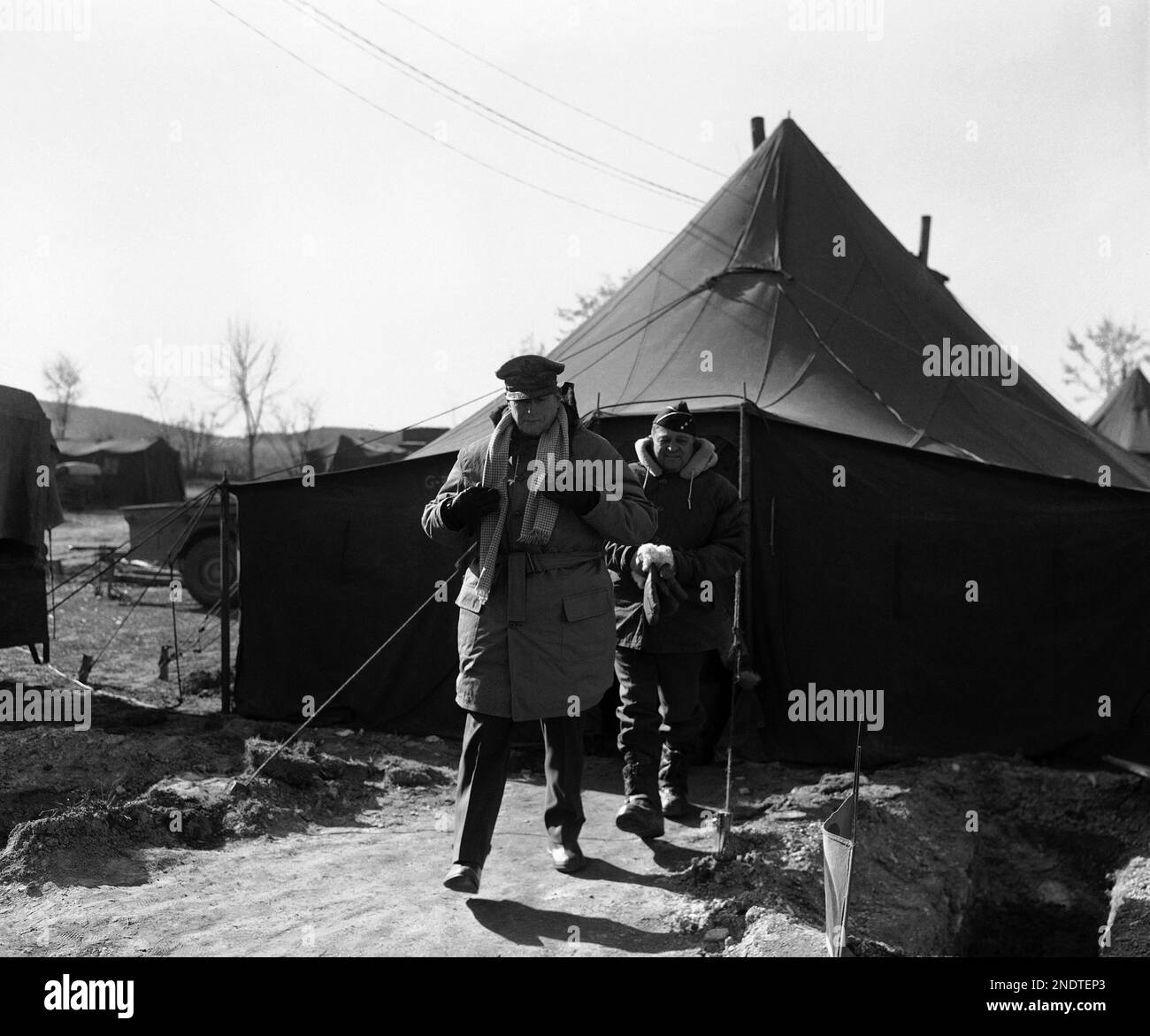 General Douglas MacArthur, followed by Lt. Gen. Walton Walker leave ...