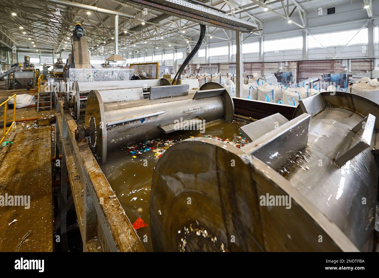 Automatic shredded plastic washing machine. Washing in a bath of water ...