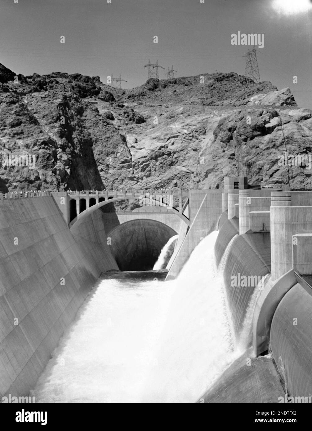 Spectators watch from bridge over spillway as Boulder Dam overflows for ...
