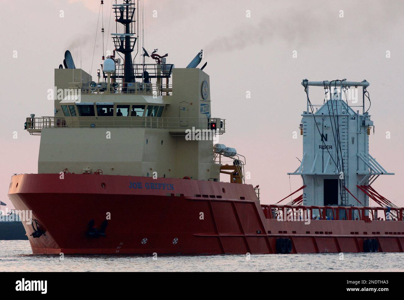 The barge Joe Griffin sails down a channel in Port Fourchon, La. on its ...