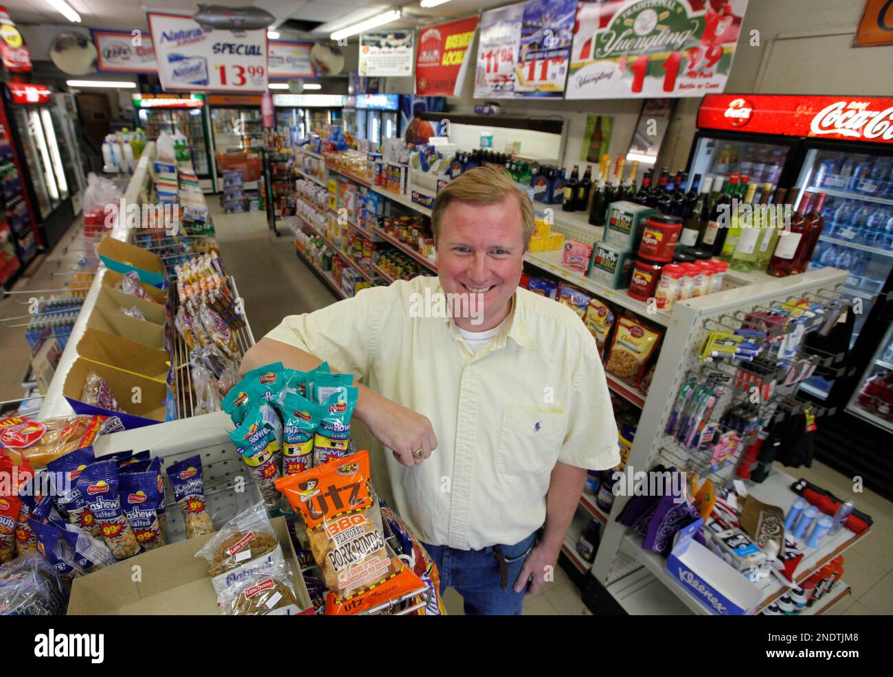 Corner Market shop owner, Chaney Kent, poses in his shop accross from ...