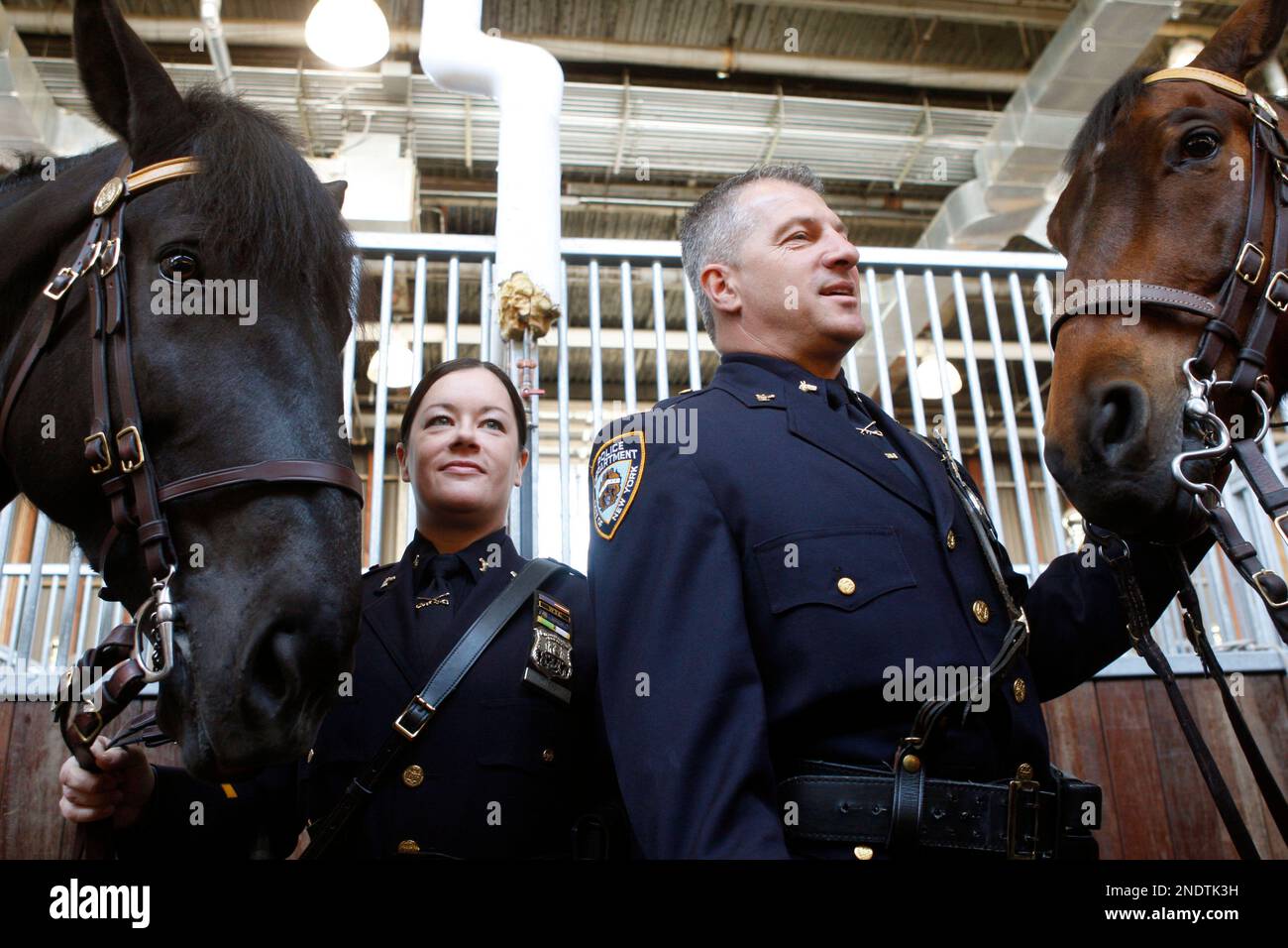 New York Police Department officers Wayne Rhatigan, right, and Pam ...
