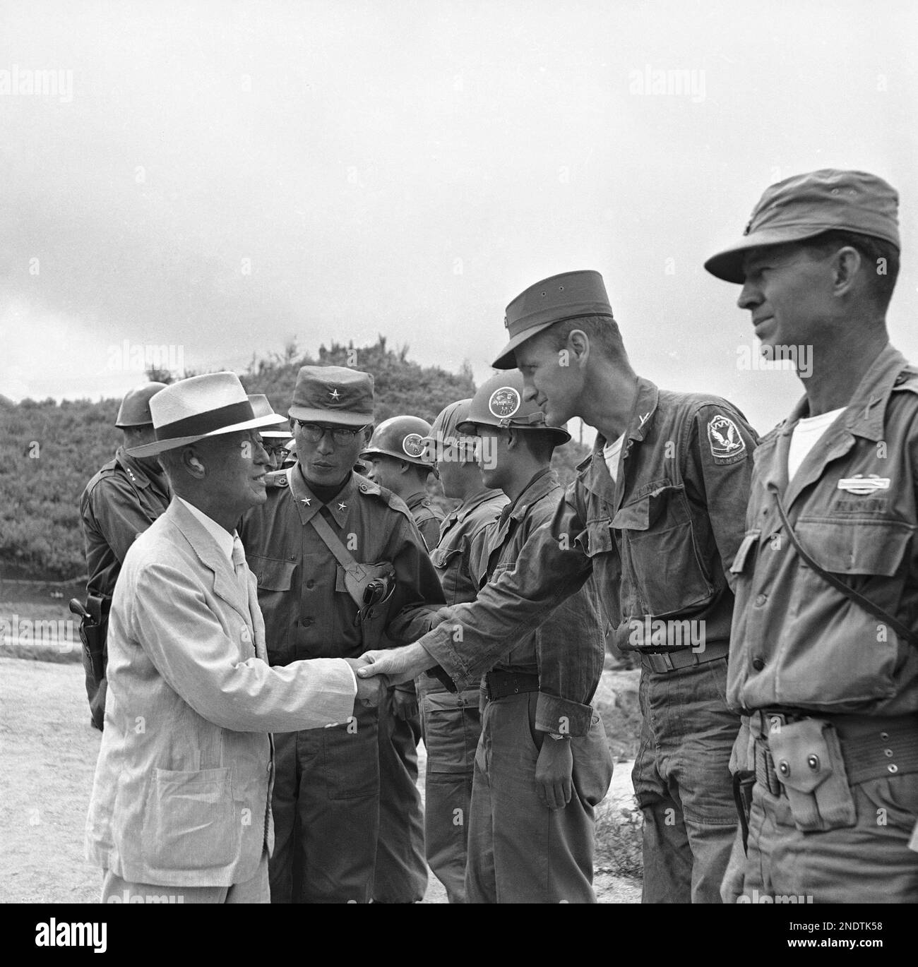 Republic of Korea President Syngman Rhee shakes hands with Major Ralph ...