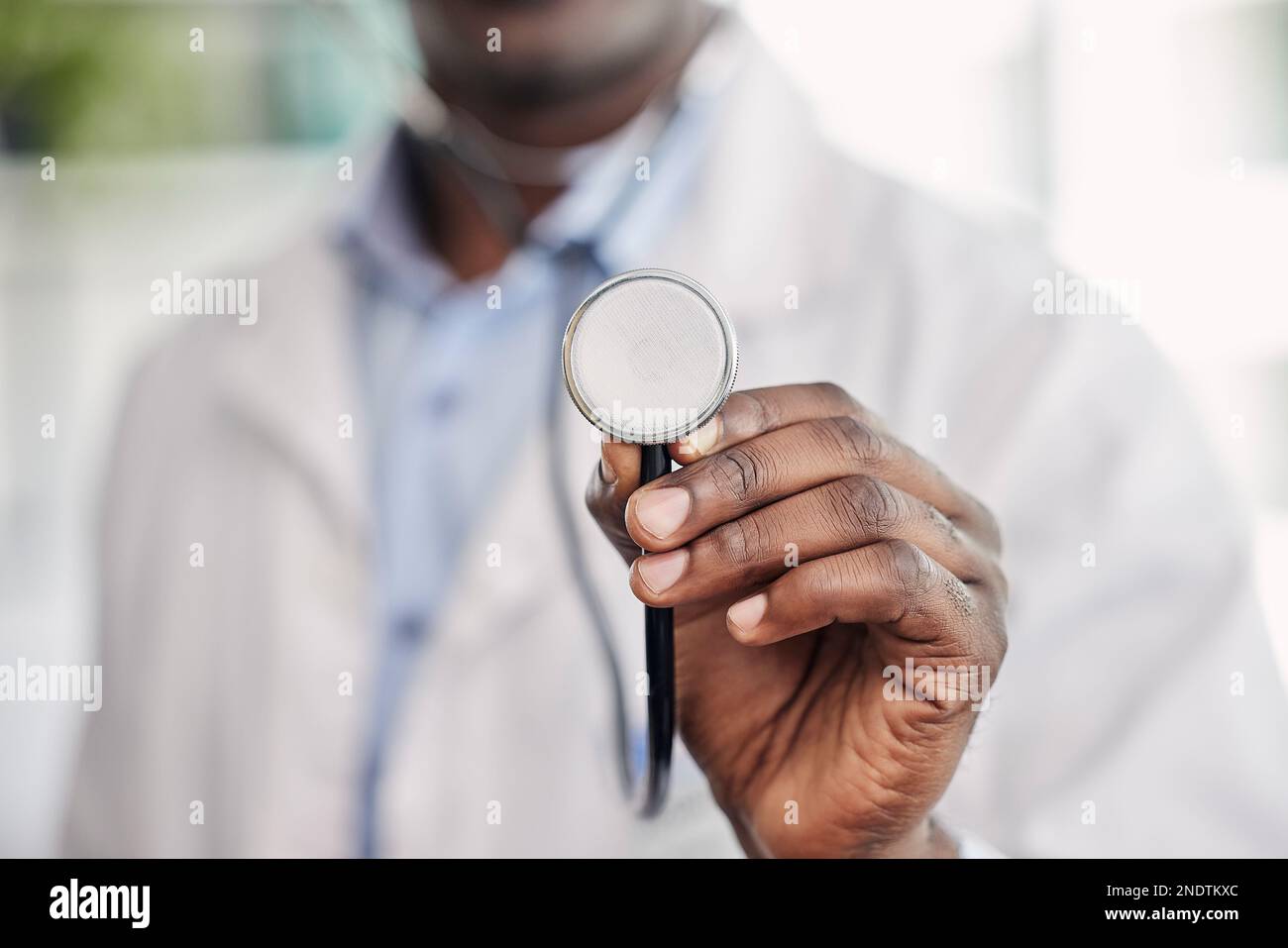 Hand, stethoscope closeup and doctor with help, healthcare service and ...