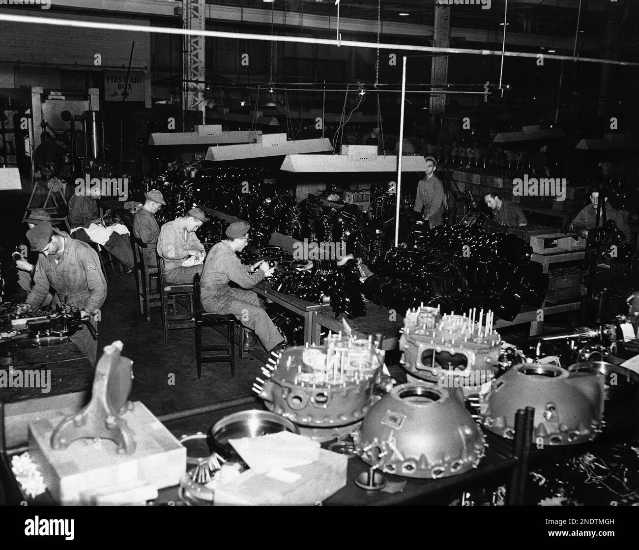 On the assembly line of a huge U.S.A.A.F. repair depot somewhere in ...