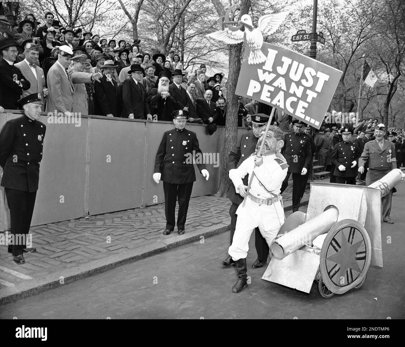 General Douglas MacArthur, on reviewing stand, second from left ...