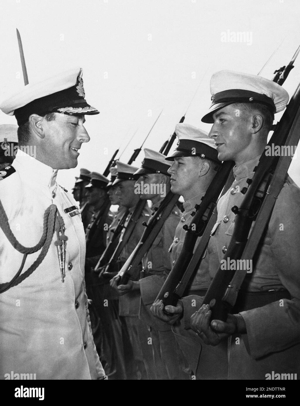 Lord Louis Mountbatten inspects the Marine honour guard as he steps ...