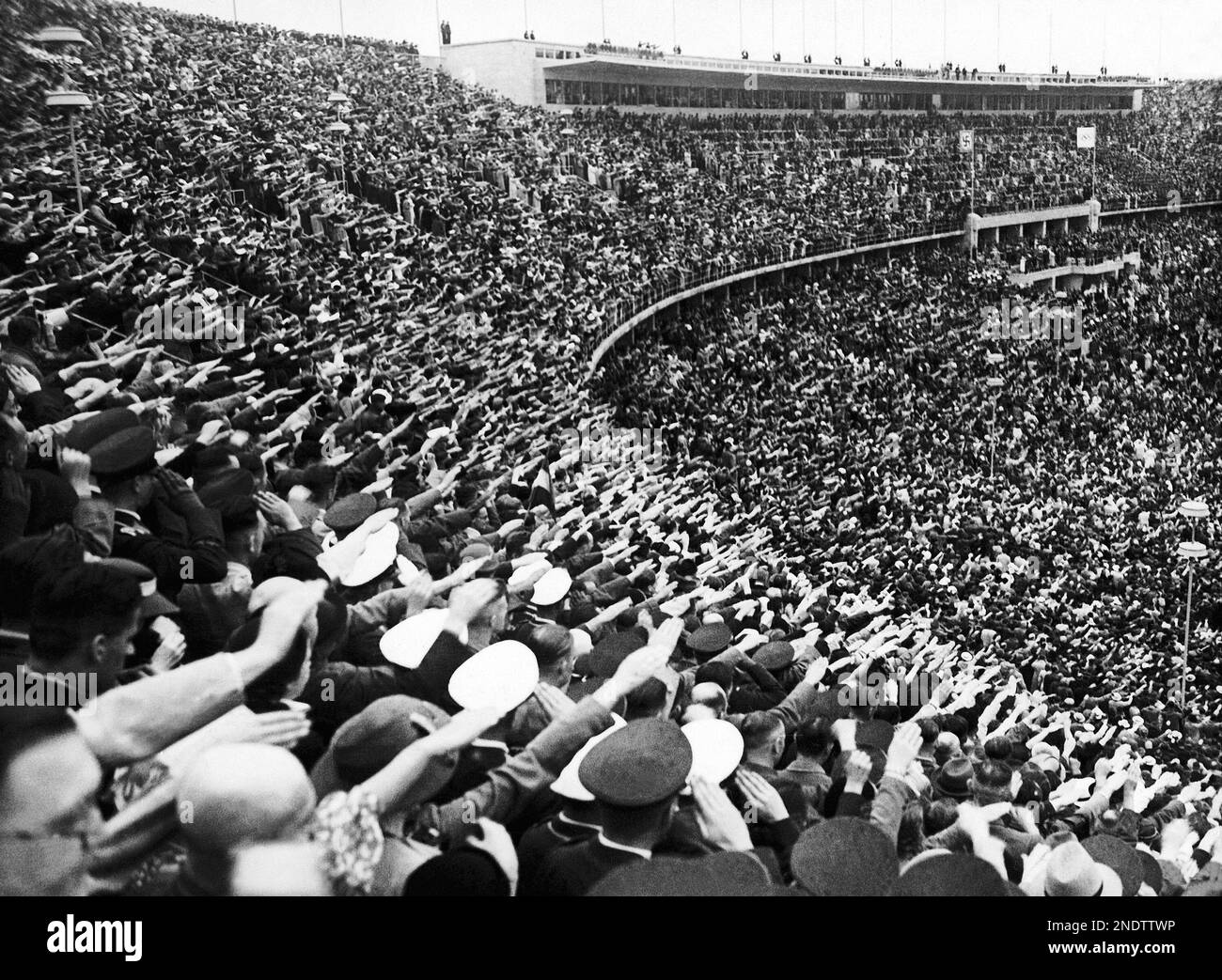 A view of a part of the vast crowd saluting the athletes during their ...