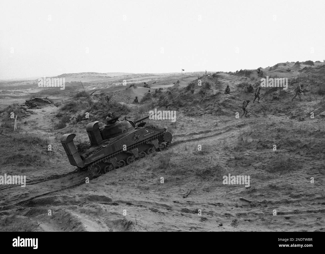 U.S. assault troops and equipment, bulldozers, lorries and jeeps came ...