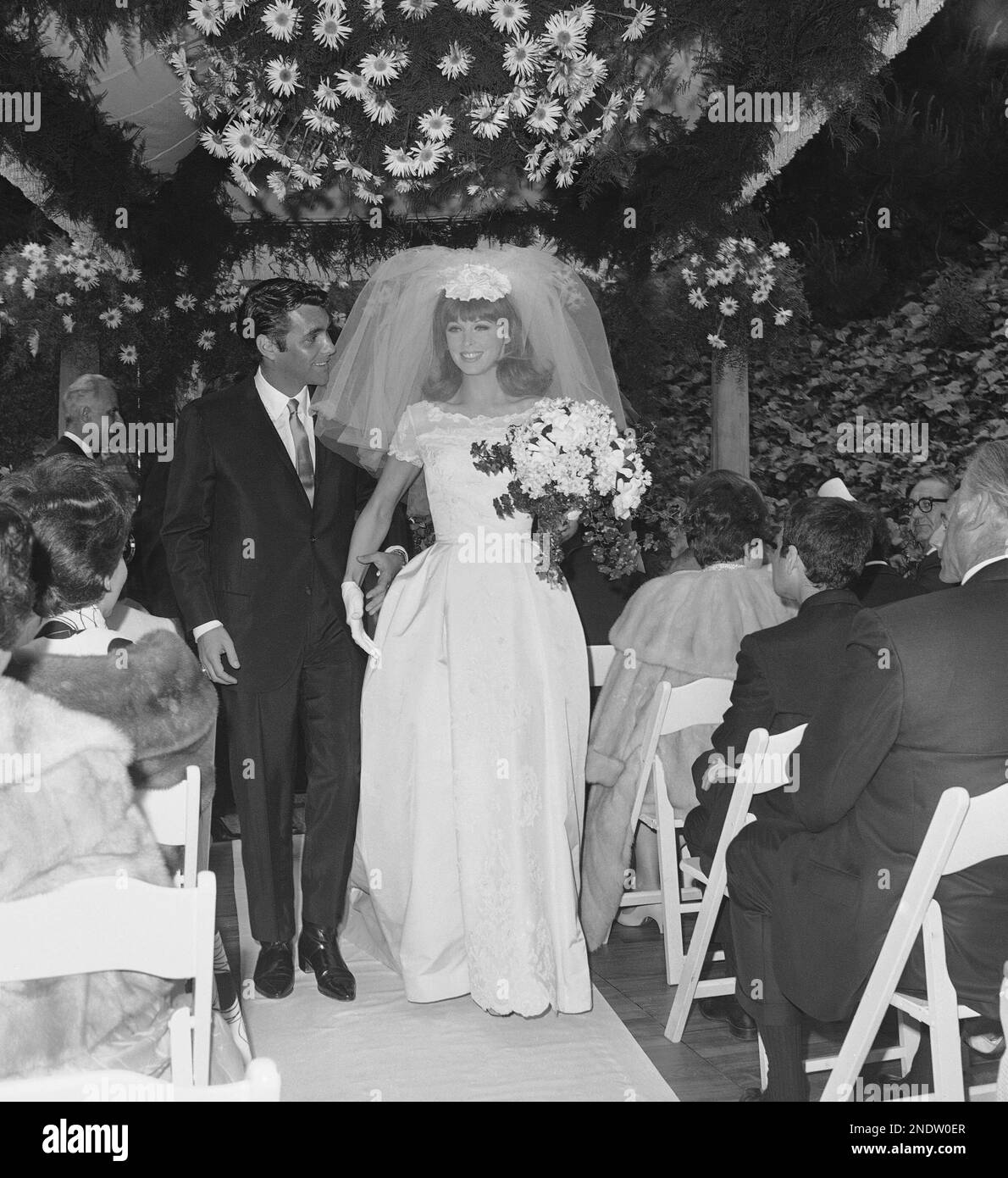Actor Les Crane and actress Tina Louise at reception following their ...