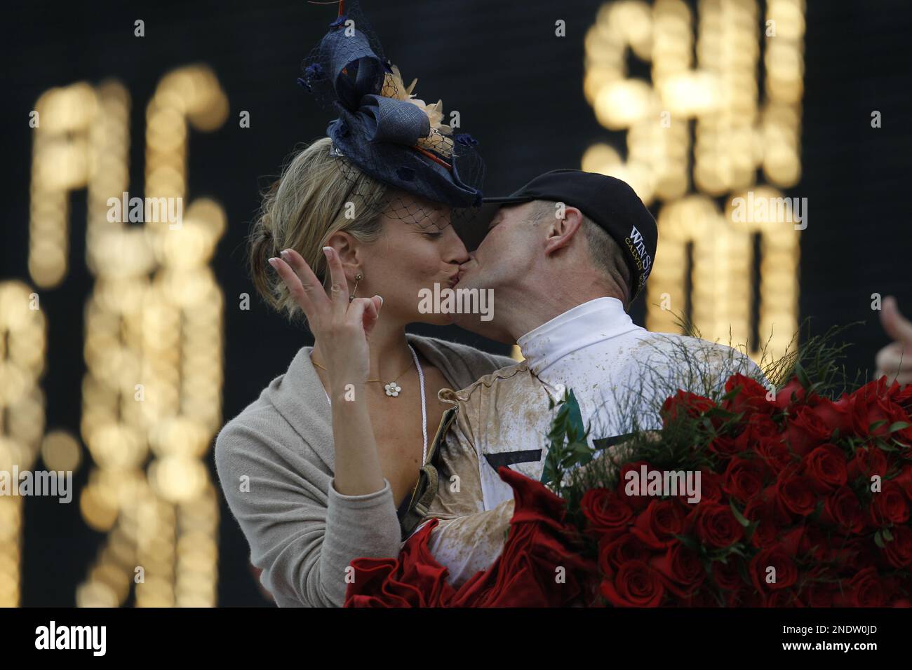 Calvin Borel kisses his wife, Lisa, after Borel rode Super Saver to ...