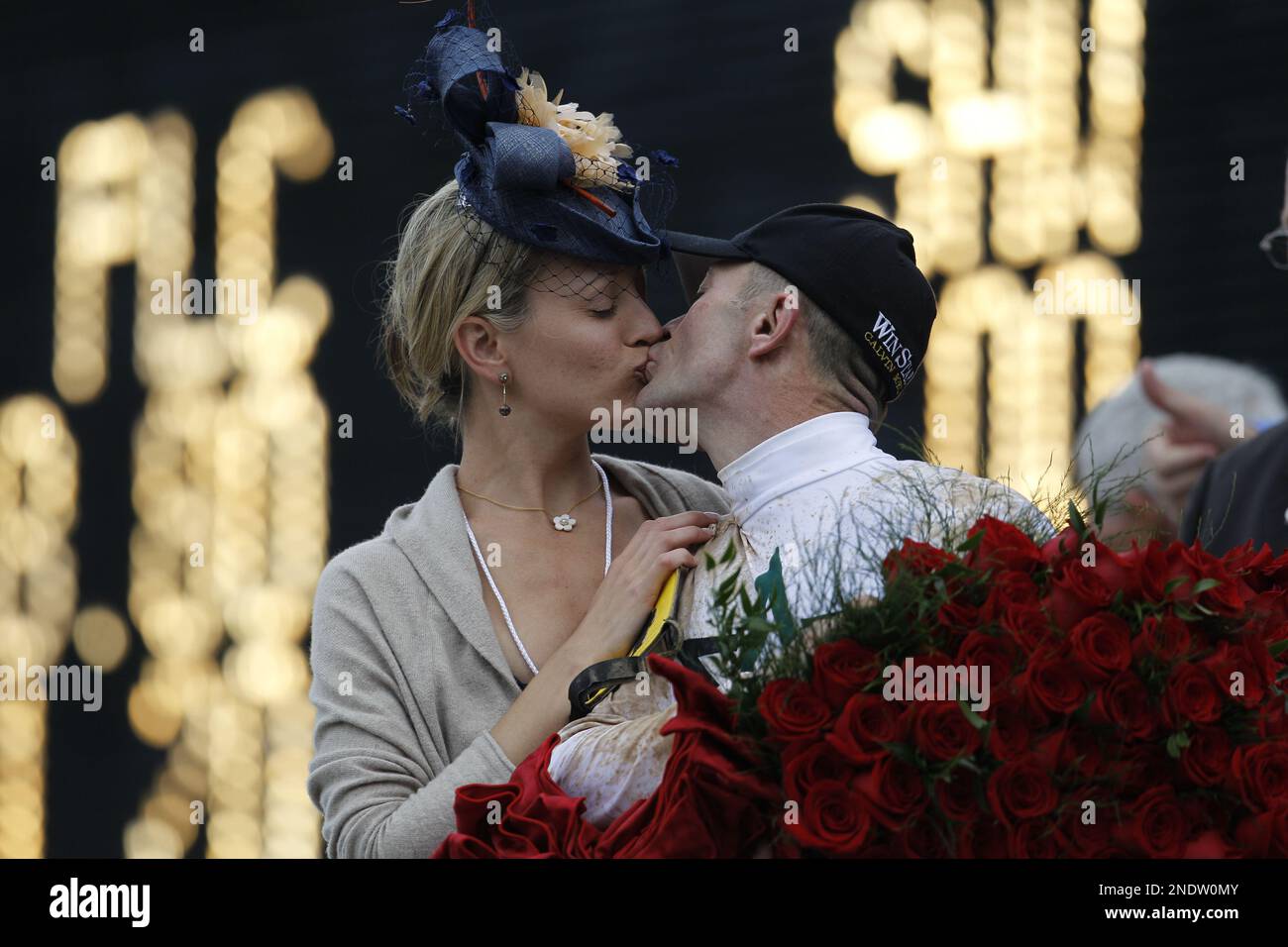Calvin Borel kisses his wife, Lisa, after Borel rode Super Saver to ...