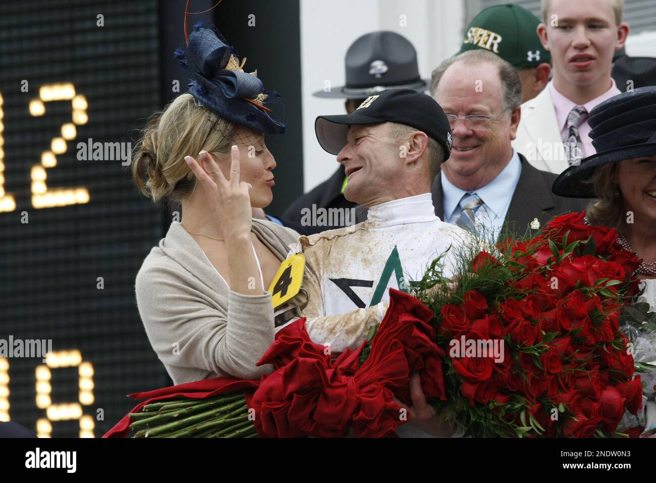 Calvin Borel kisses his wife, Lisa, after Borel rode Super Saver to ...