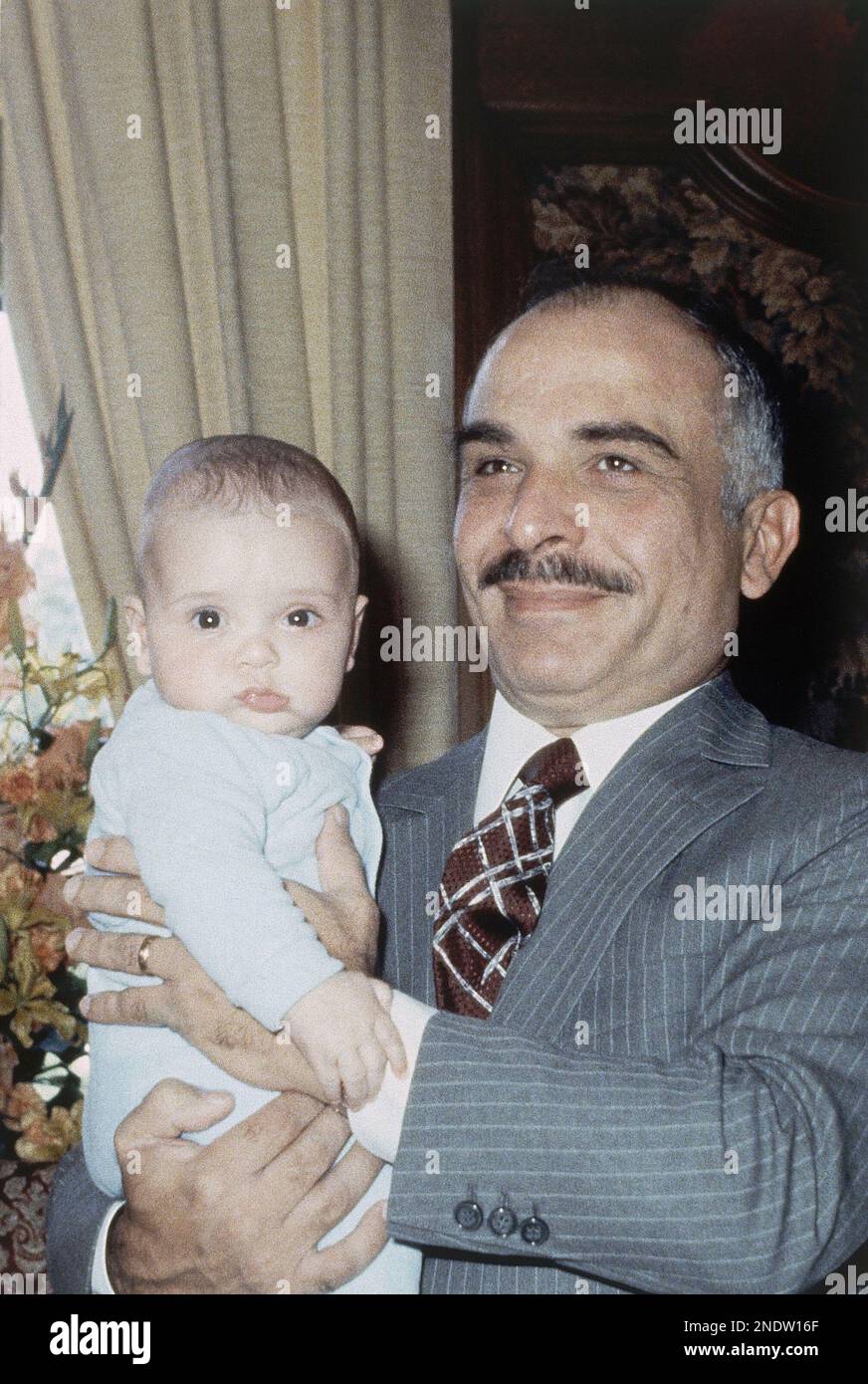 King Hussein of Jordan proudly shows off his 4-month-old son Prince ...