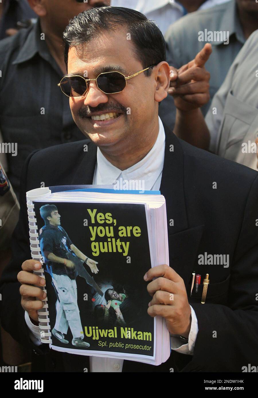 India's Special Public prosecutor Ujjwal Nikam smiles as he holds his ...