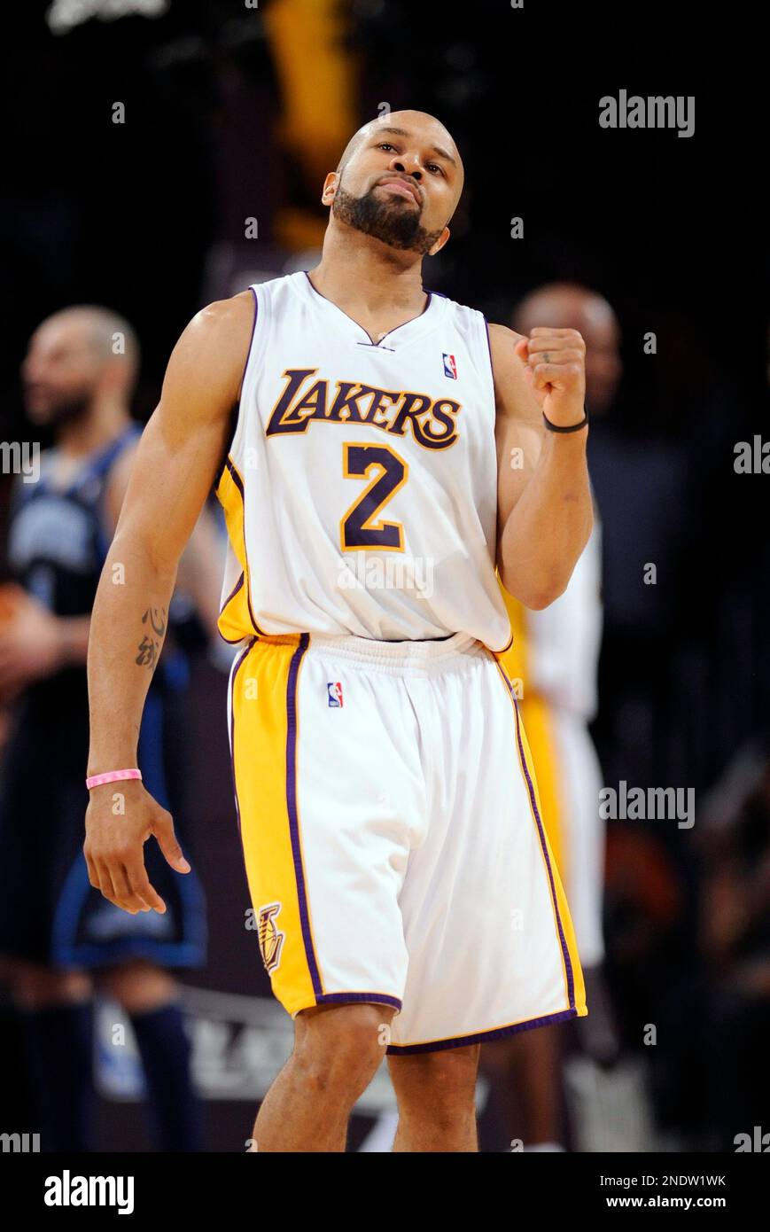 Los Angeles Lakers guard Derek Fisher celebrates after scoring during ...