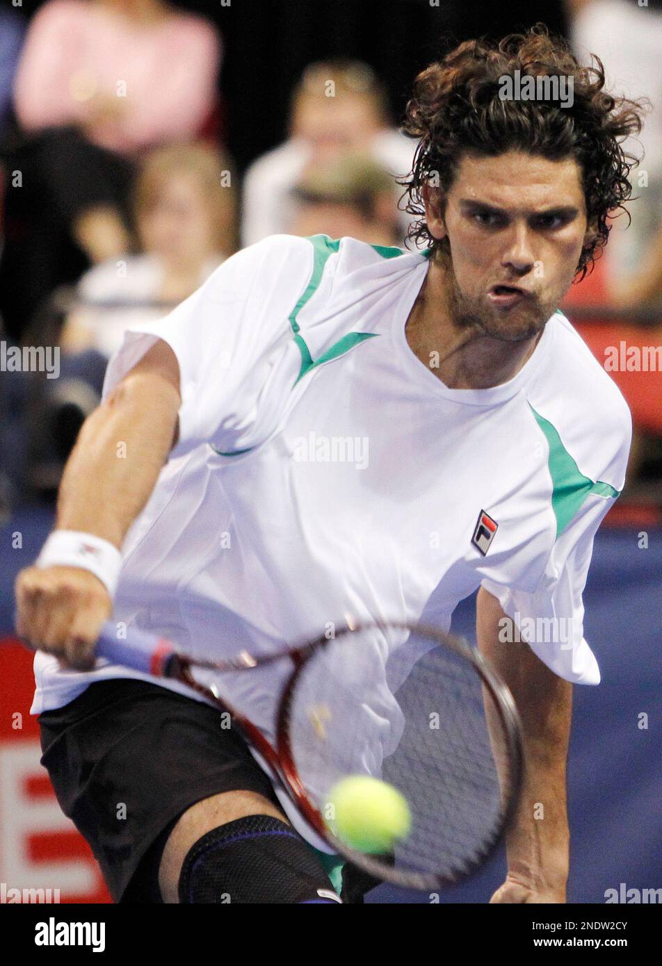 Mark Philippoussis returns the ball to John McEnroe during the ...
