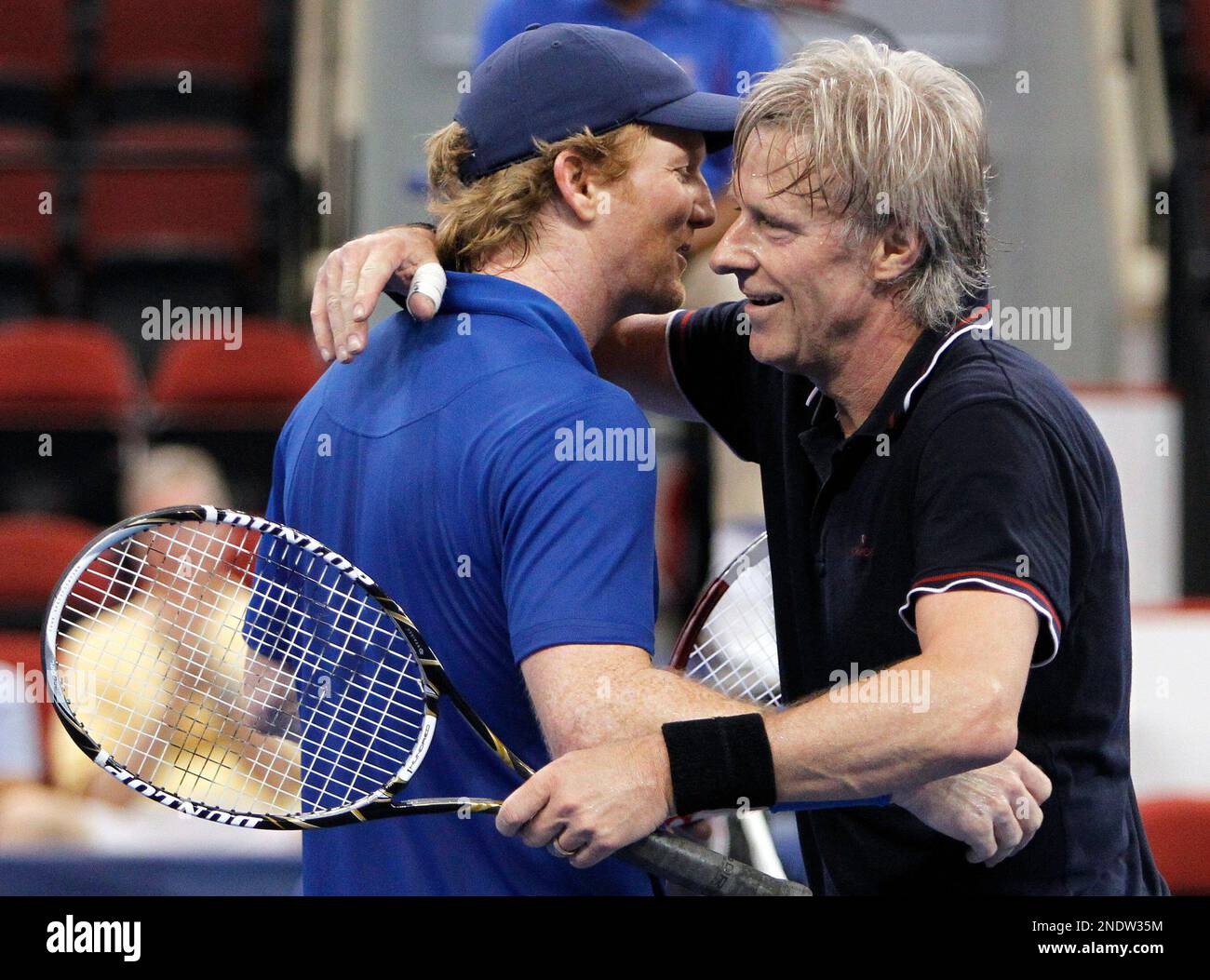 Jim Courier, left, of the United States, and Bjorn Borg, of Sweden, hug ...