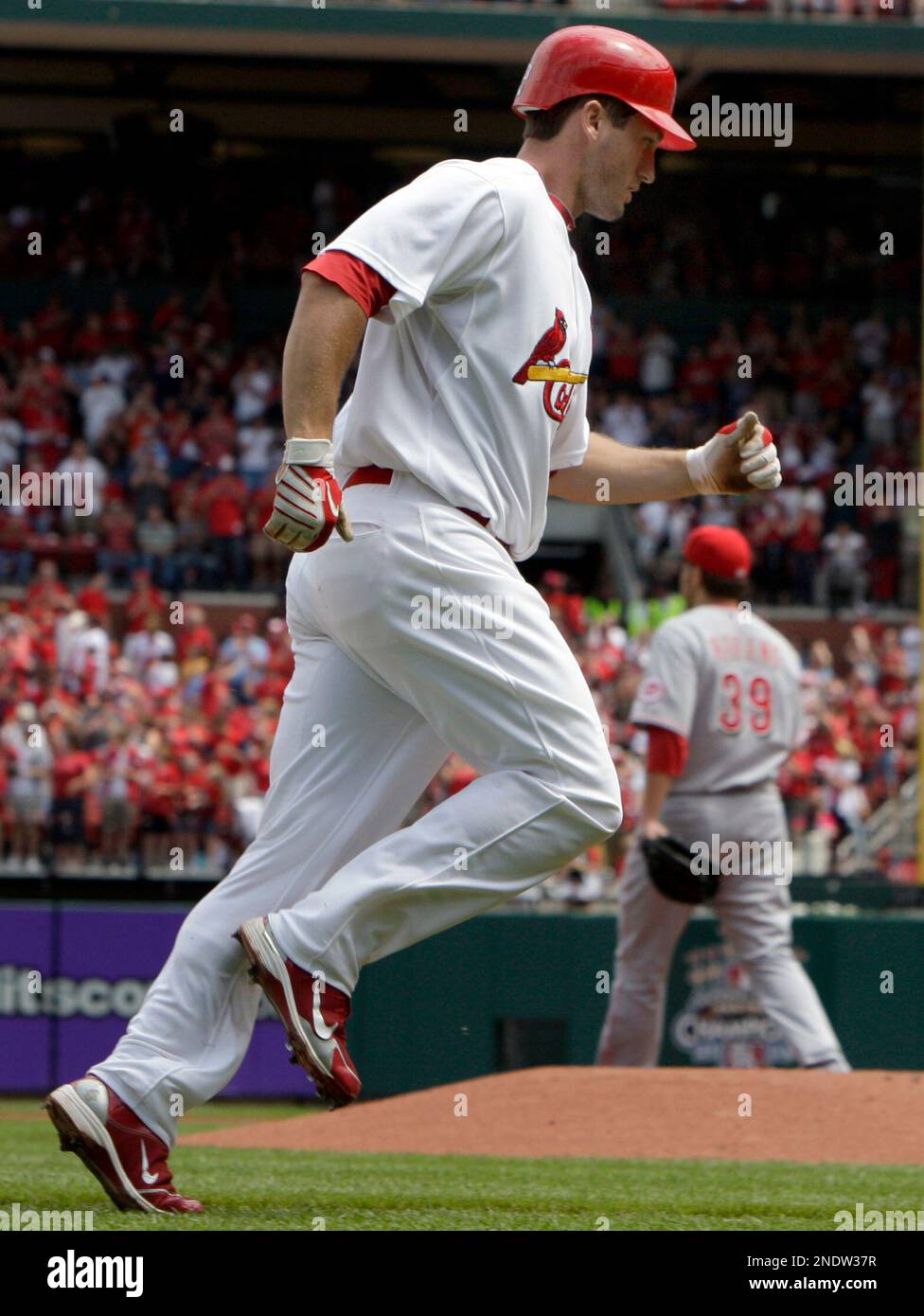 St. Louis Cardinals' David Freese, left, rounds the bases after hitting ...