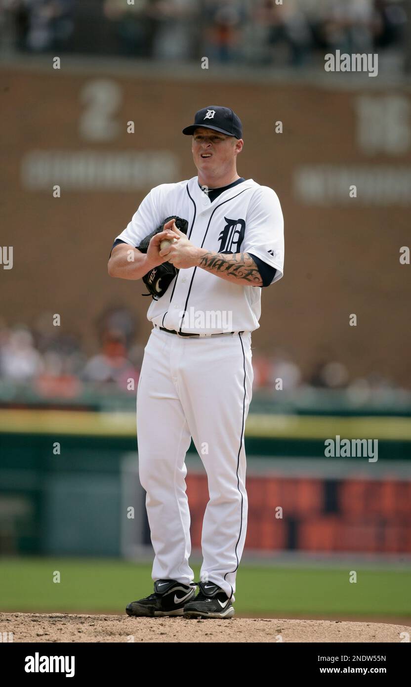 Detroit Tigers starting pitcher Jeremy Bonderman rubs up a baseball ...