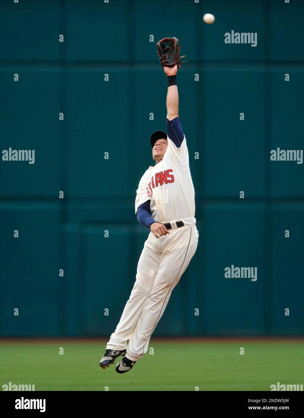 Cleveland Indians' Asdrubal Cabrera leaps for a base hit by Minnesota ...