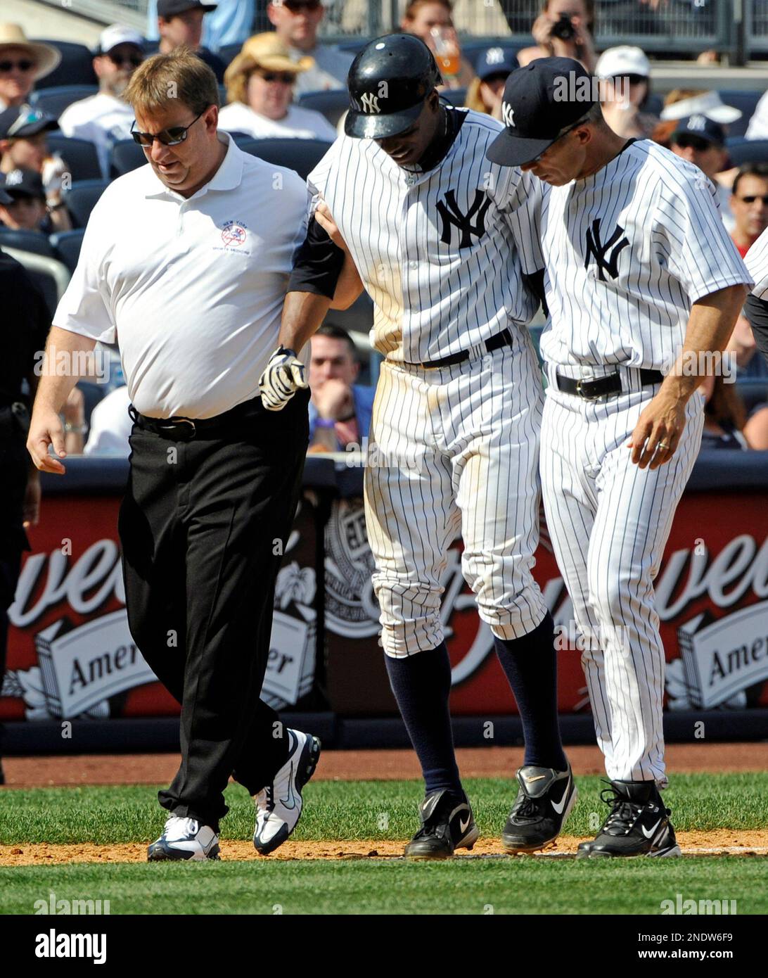 New York Yankees trainer Mark Littlefield, left, and manager Joe ...