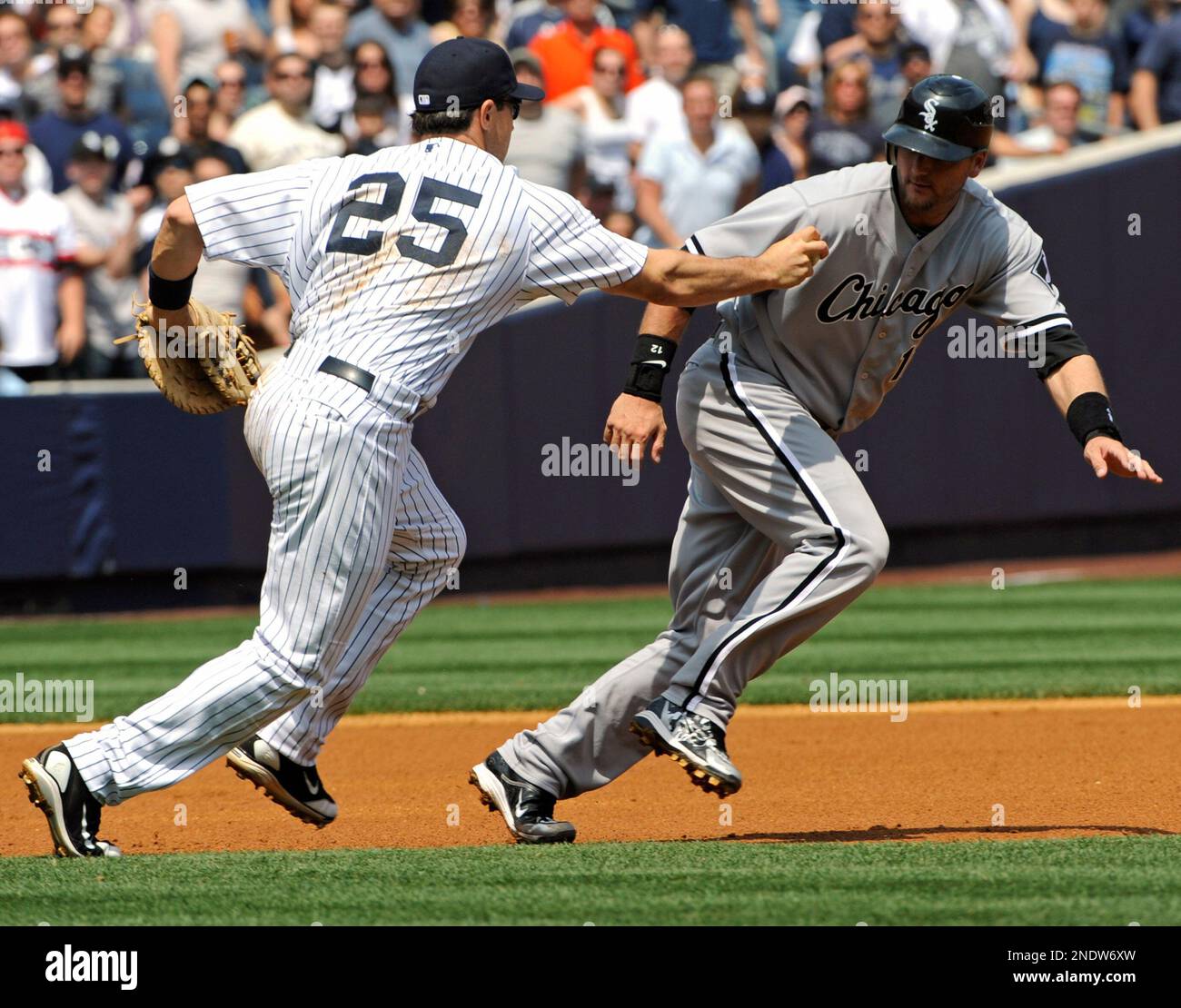 New York Yankees first baseman Mark Teixeira, left, tags out Chicago ...