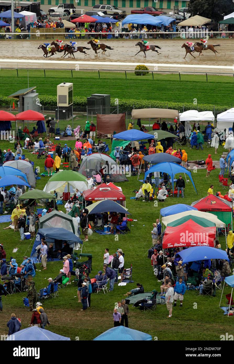 Fans gather in the infield during a race before the 136th Kentucky ...