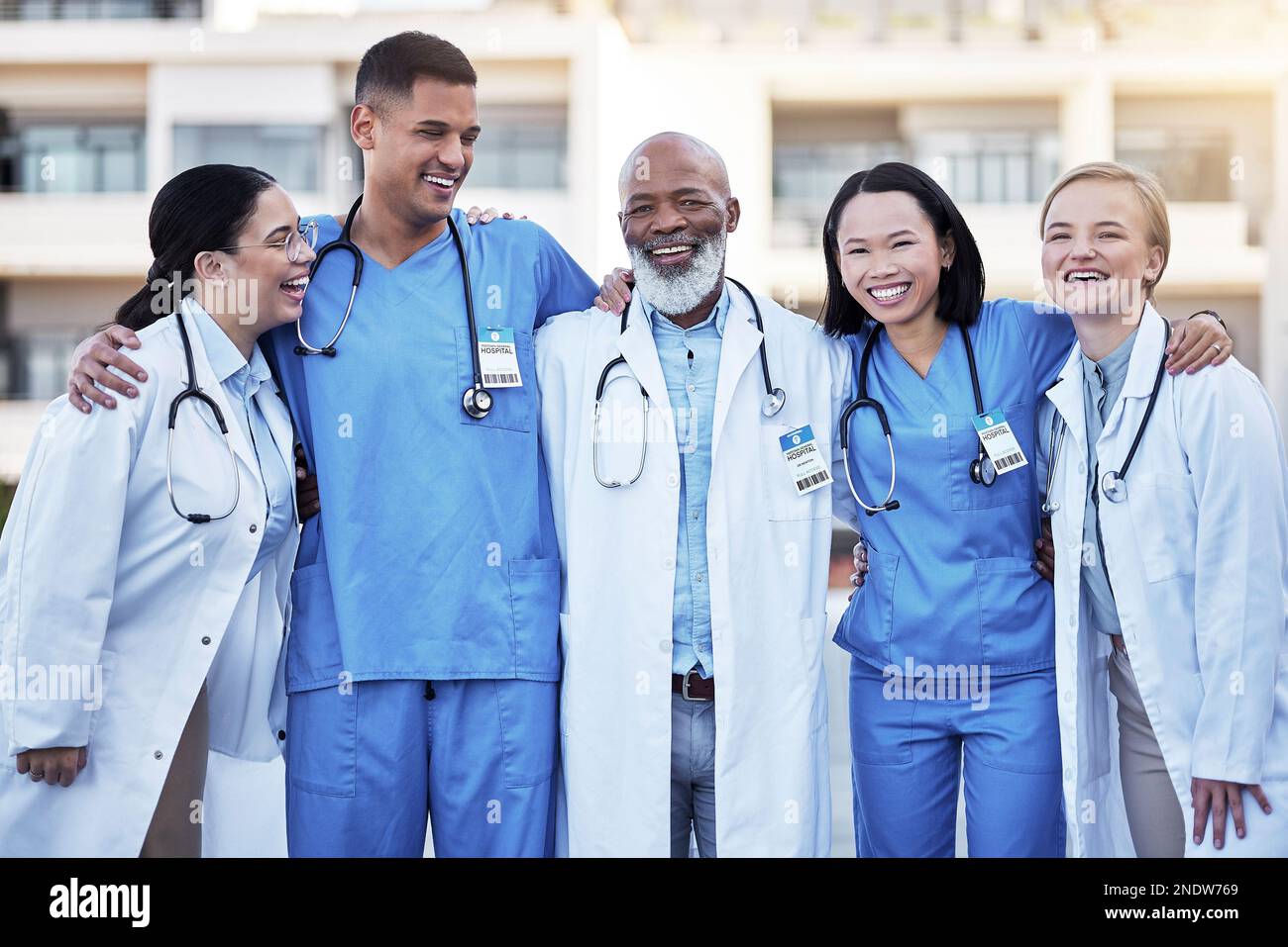 Healthcare, collaboration and doctors with nurses in medicine standing outdoor at a hospital as ...